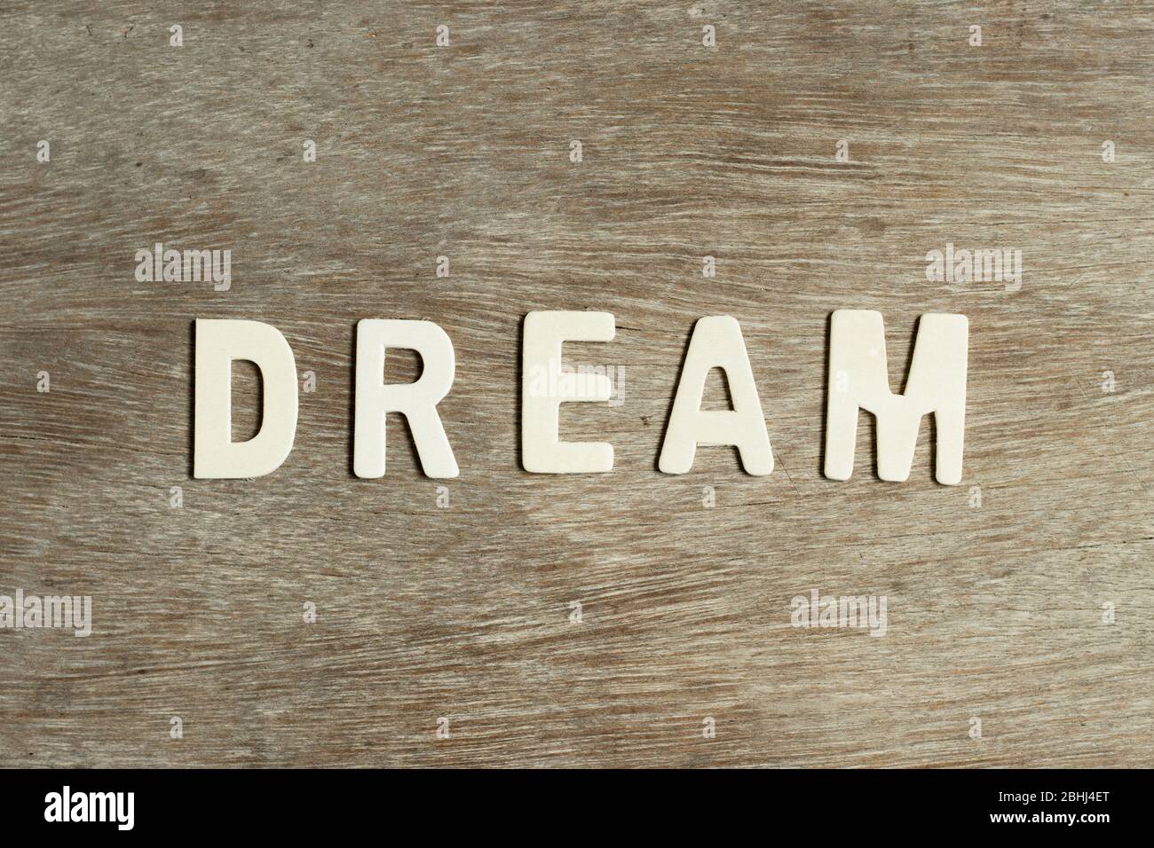 Alphabet letter in word dream on wood background Stock Photo - Alamy