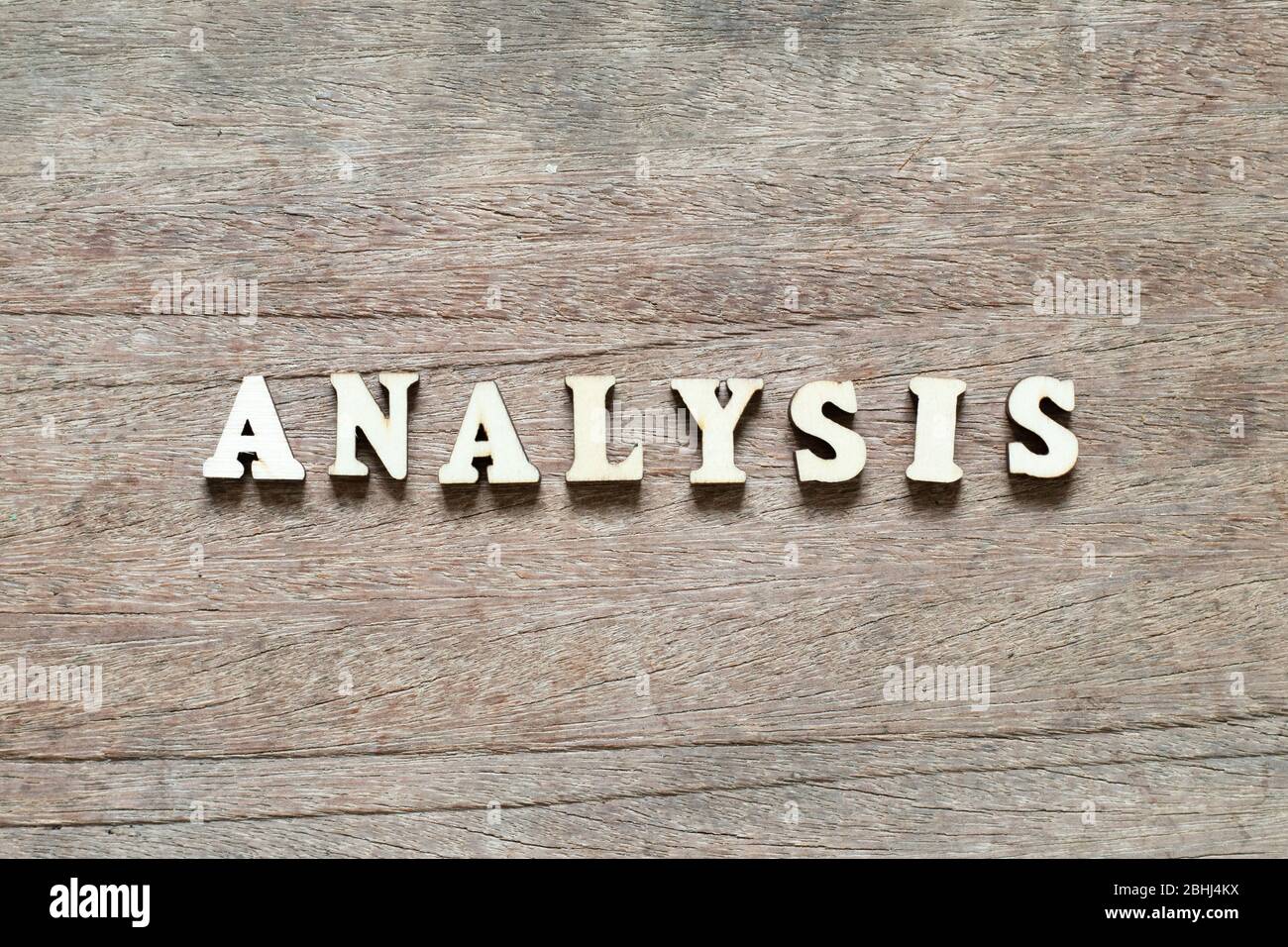Letter block in word analysis on wood background Stock Photo - Alamy