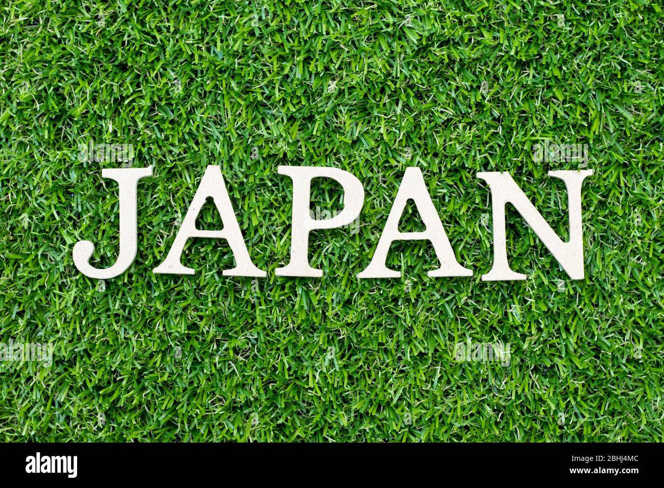 Wood alphabet letter in word japan on green grass background Stock ...