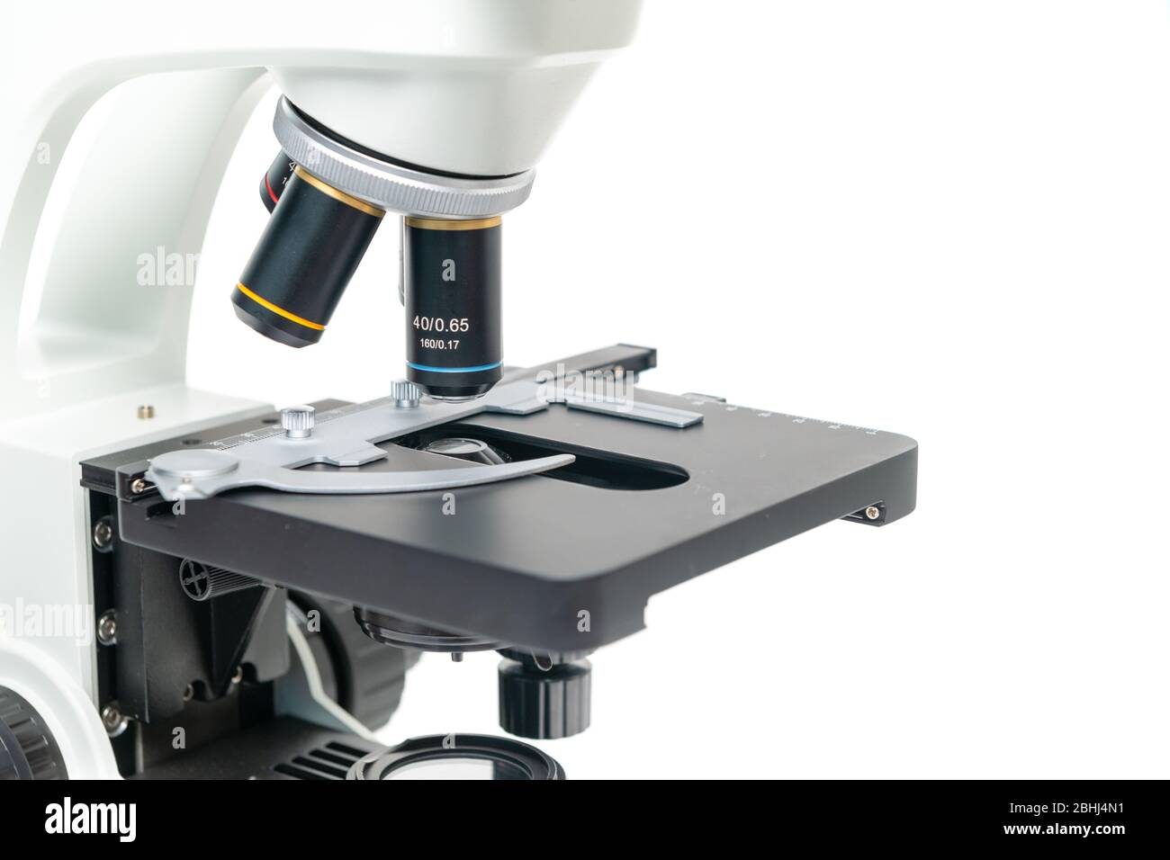 closed up of microscope isolated on white background, science and ...