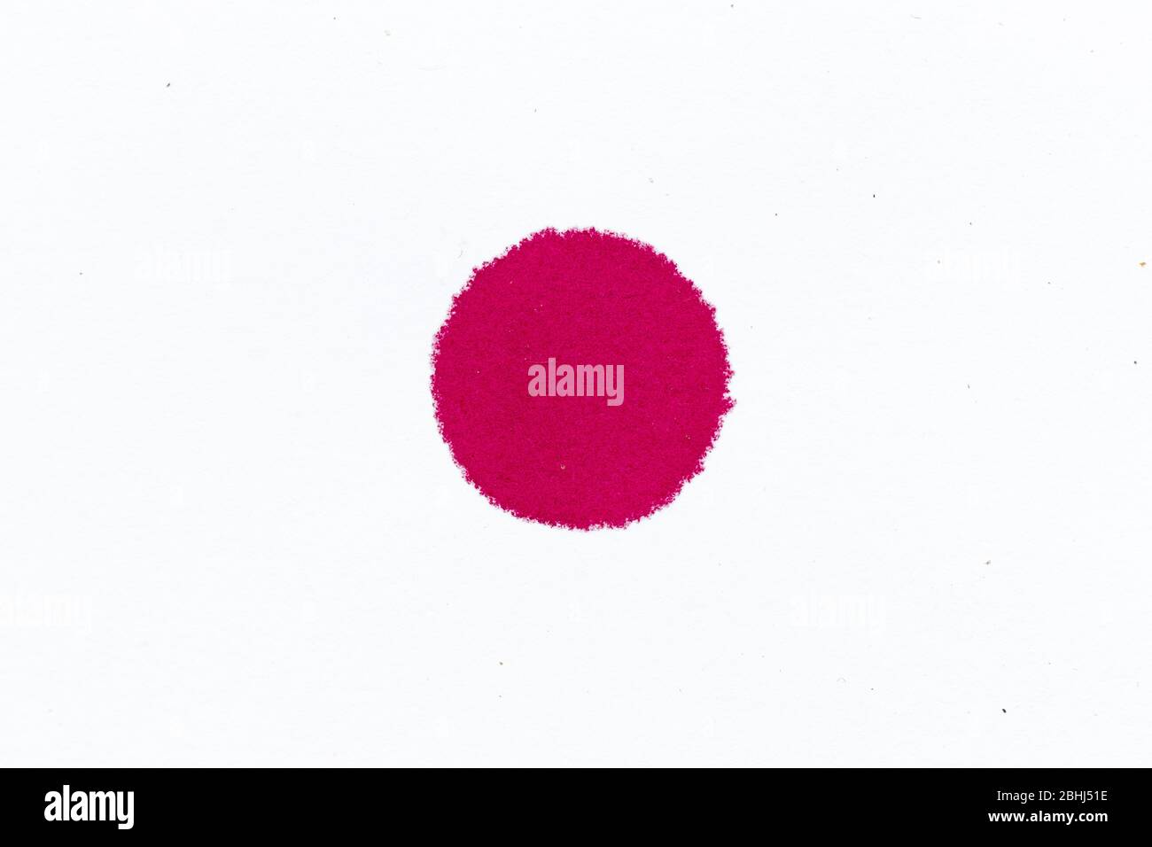 Red ink dot splashed on white paper background Stock Photo - Alamy
