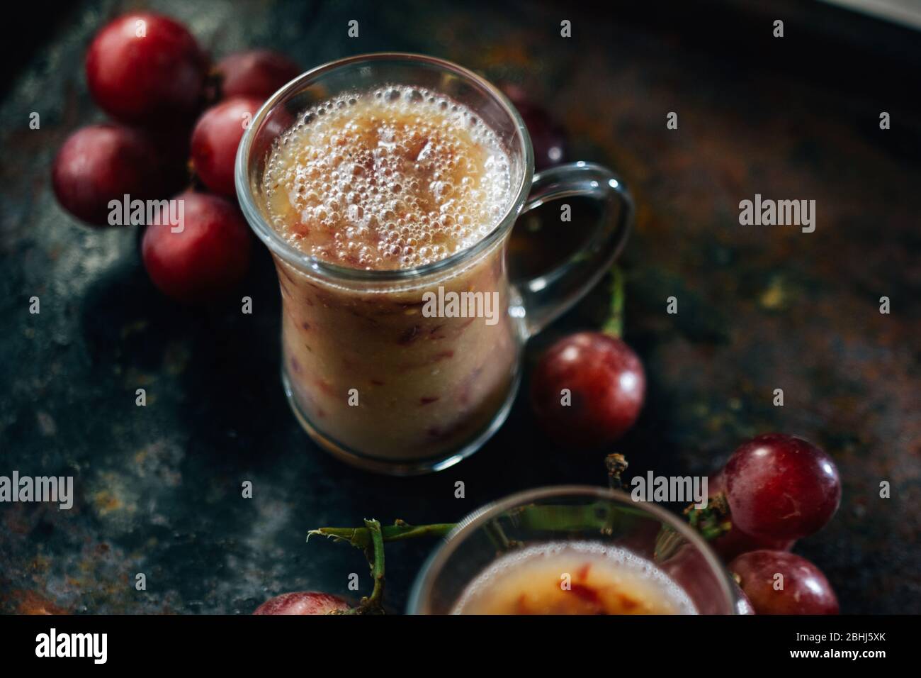 Grape lassi - made from fresh grapes on black table Stock Photo - Alamy