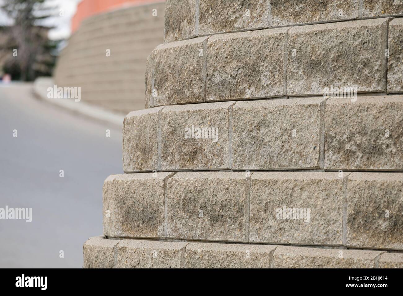 Retaining wall next to pavement on city Street Stock Photo - Alamy
