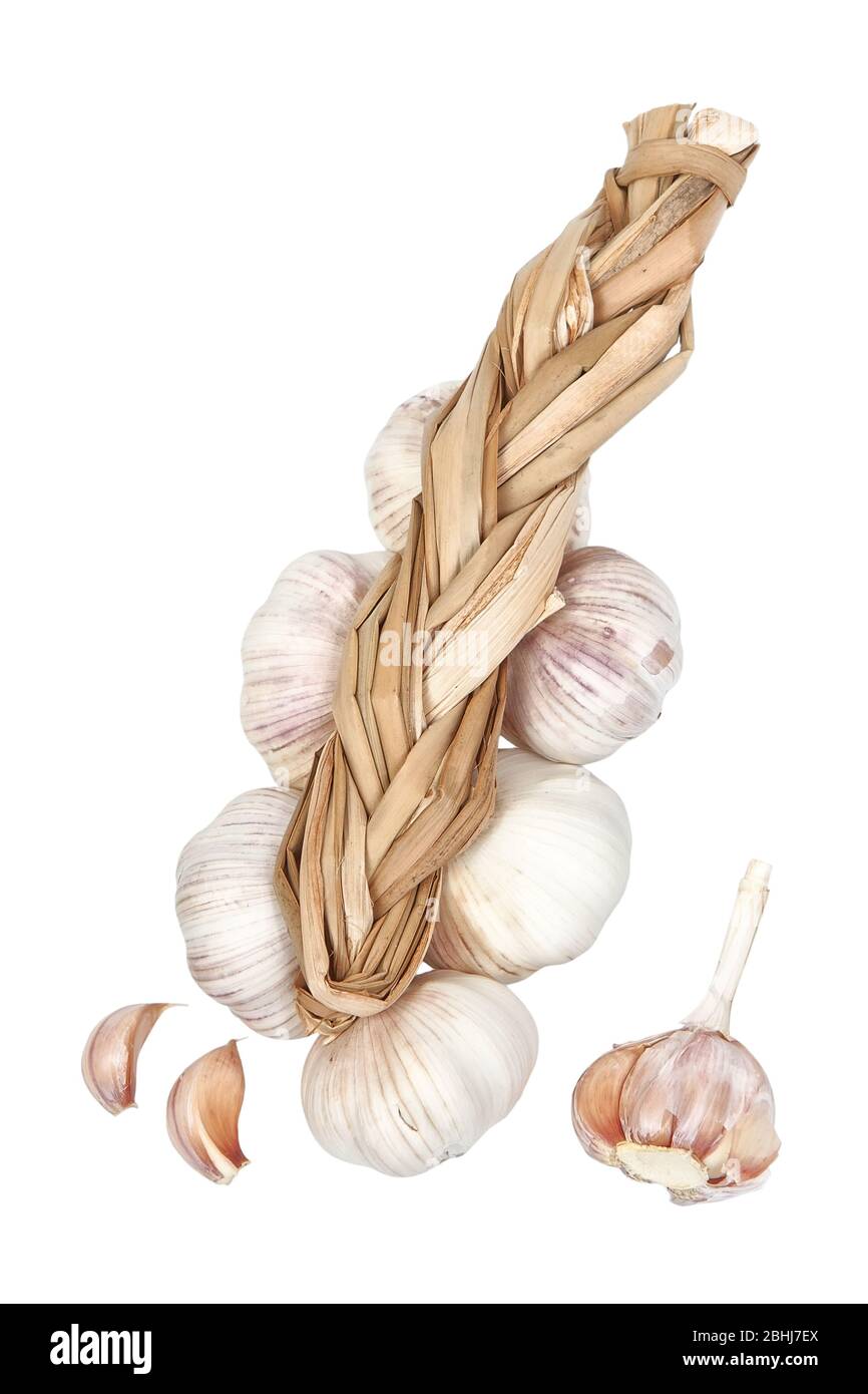 Braid of garlic and slices on a white background Stock Photo - Alamy