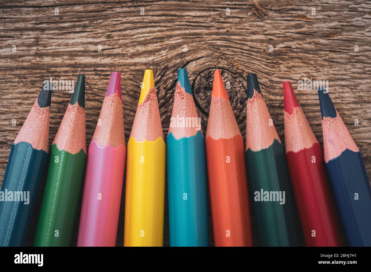 Colored pencil crayons on the wooden background, close-up view Stock ...