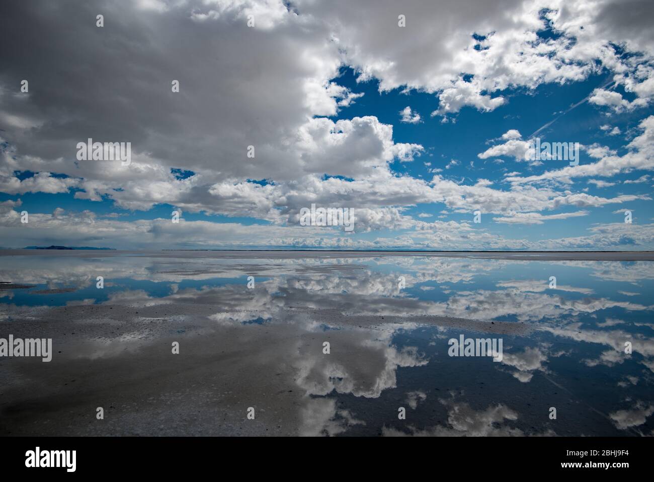 Bonneville Salt Flats after a rainstorm. Reflections of sky and clouds ...
