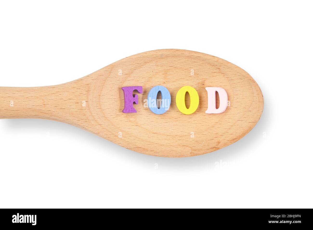 Colorful letters in a spoon isolated on white background Top view Stock ...