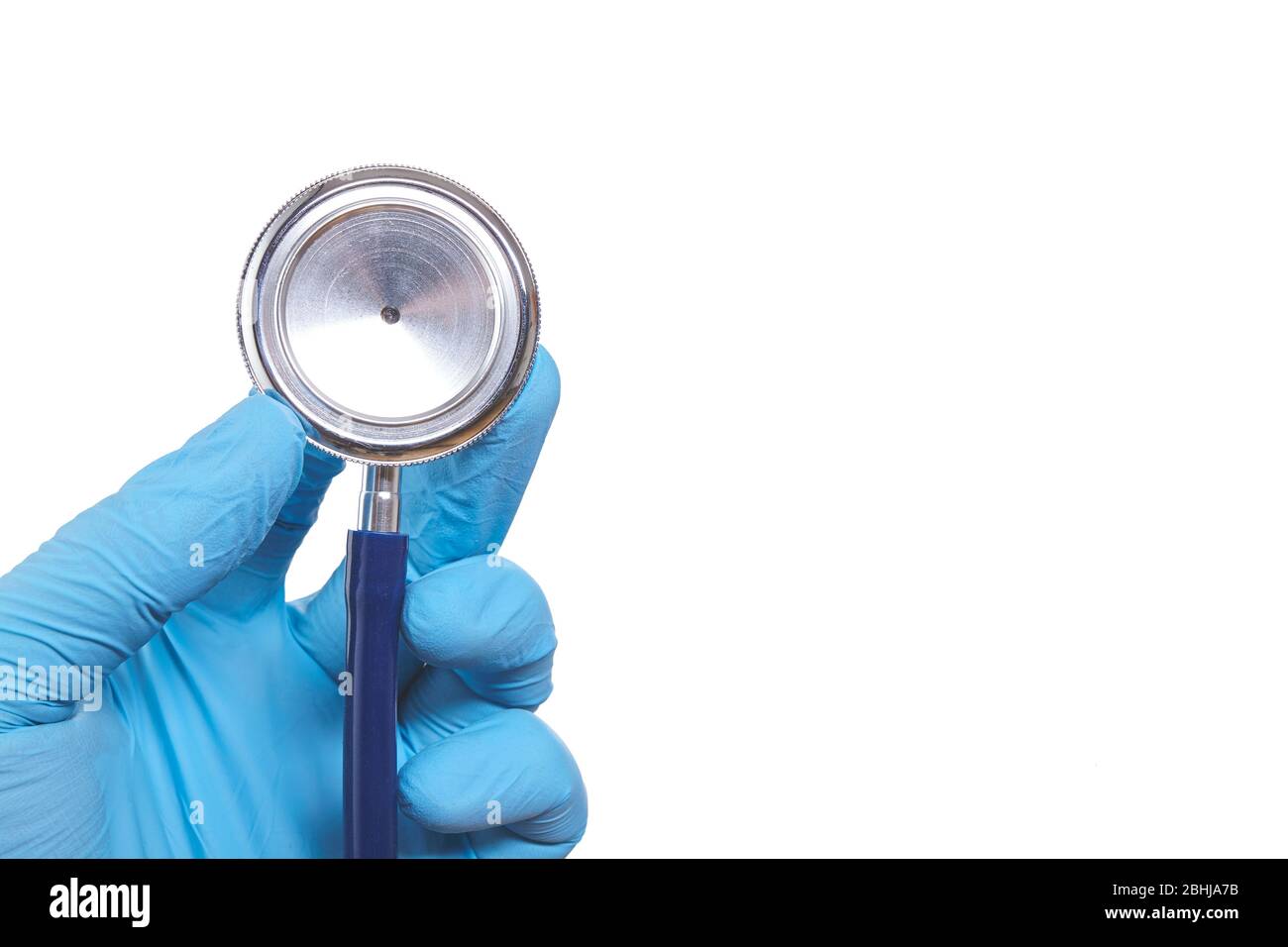 Doctor's hand in blue medicine glove with stethoscope isolated white ...