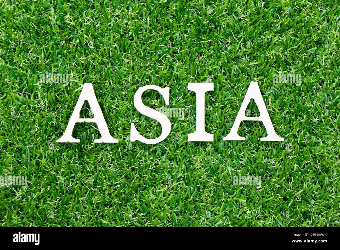 Wood letter in word asia on green grass background Stock Photo - Alamy