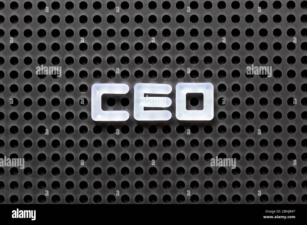 Black color pegboard with white letter in word CEO (abbreviation of ...