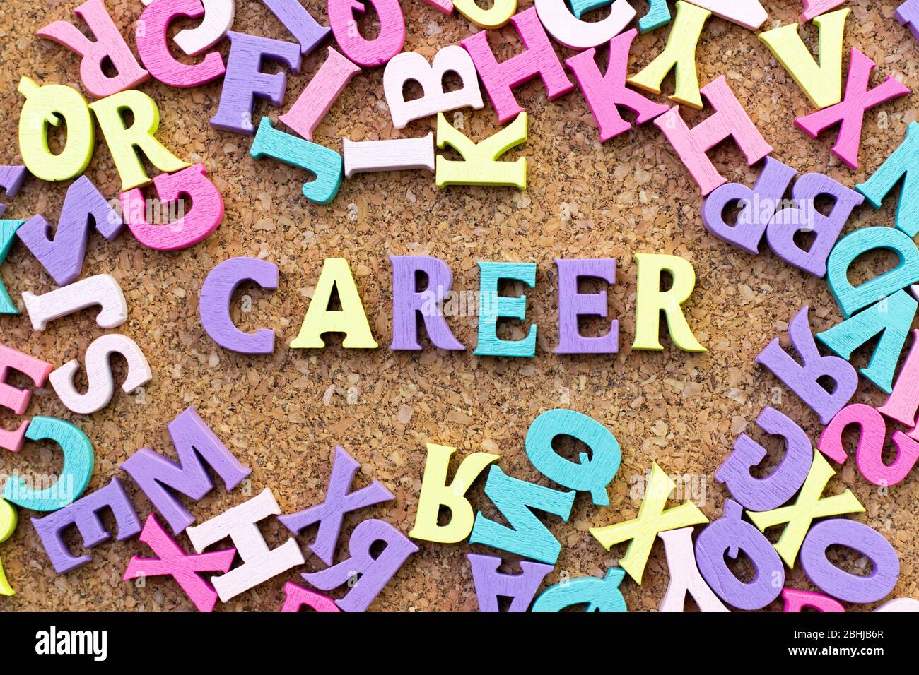 Color alphabet in word career with another letter as frame on cork ...