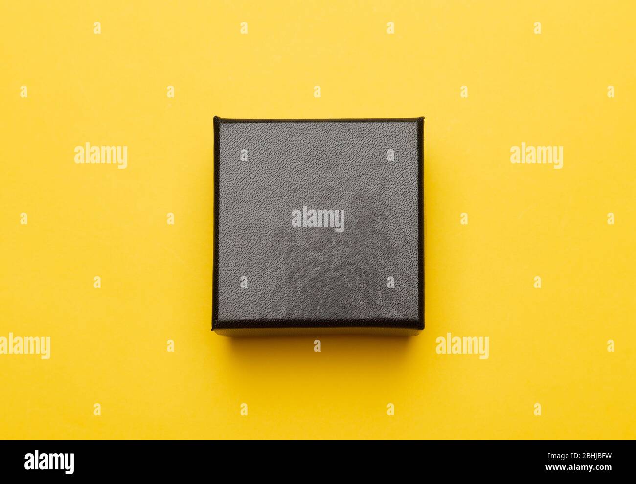 Mini black box product packaging isolated on yellow background, Flat ...