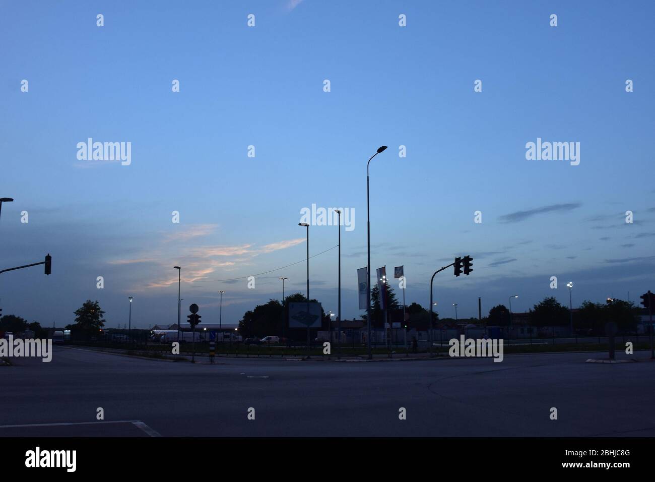 Twilight over wide city and empty intersection Stock Photo - Alamy