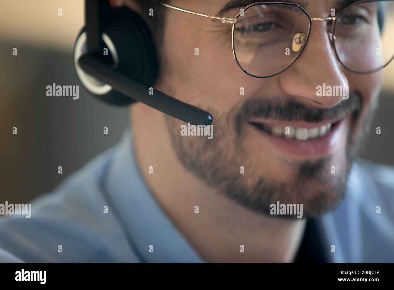 Close up smiling friendly man wearing headset with microphone Stock ...