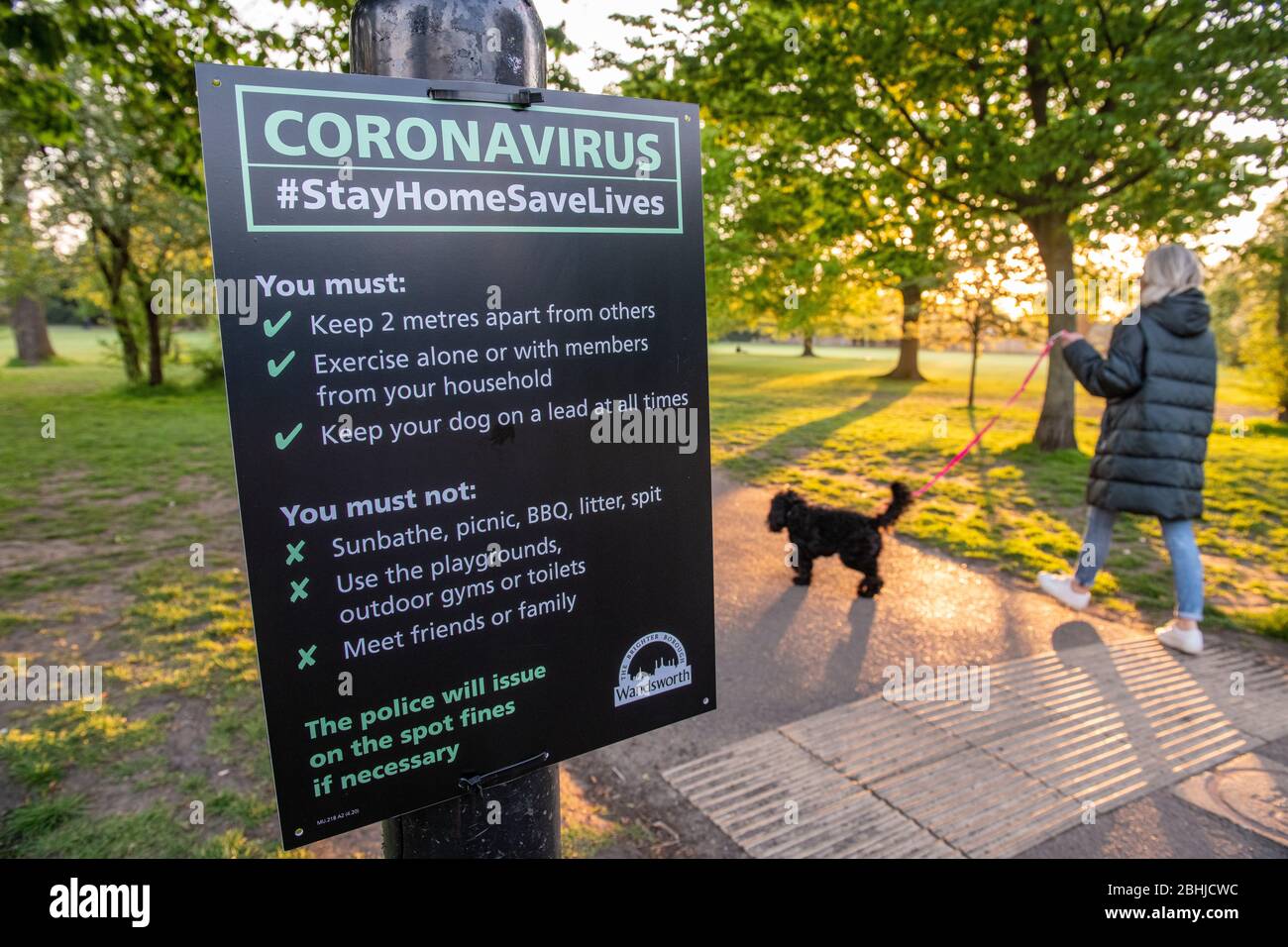A sunny day in lockdown and a Coronavirus sign with instructions on Do ...