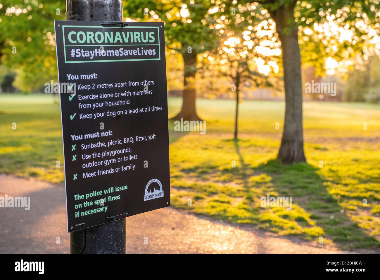 A sunny day in lockdown and a Coronavirus sign with instructions on Do ...