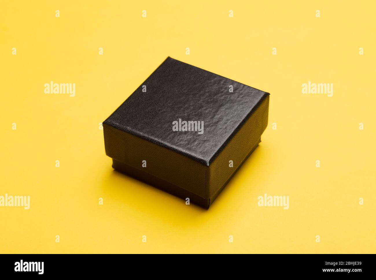 Mini black box product packaging isolated on yellow background Stock ...