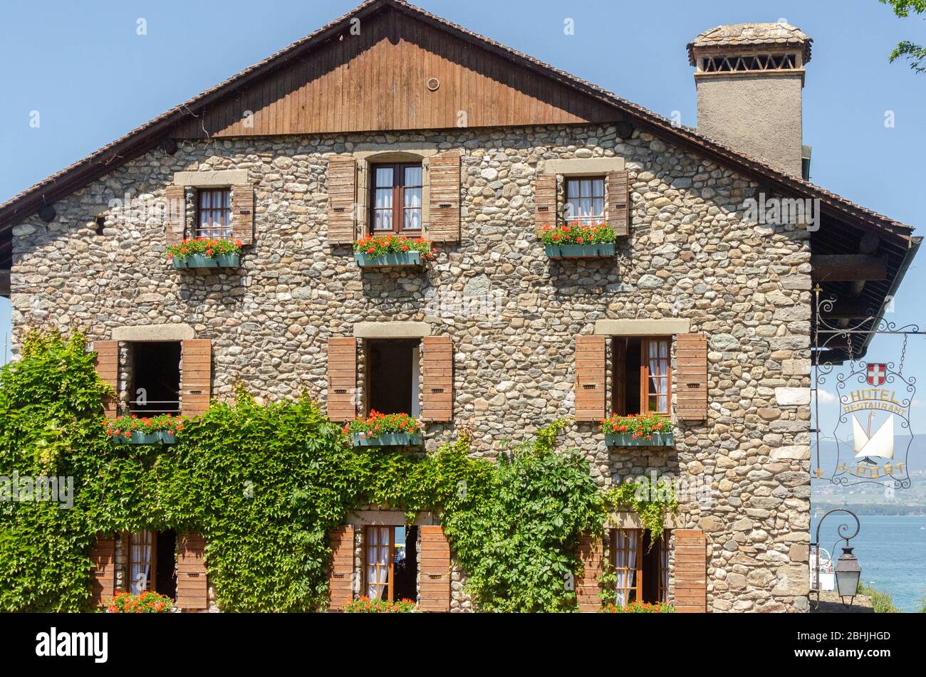 Facade of a beautiful stone wall medieval house in Yvoire, France Stock ...