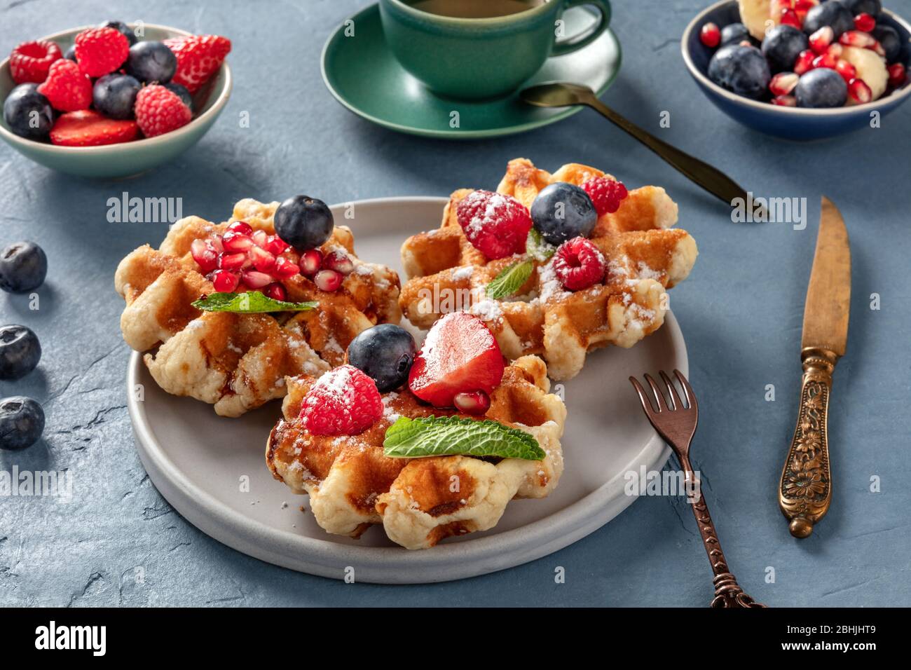 Belgian Waffles with fresh fruit and mint leaves, tasty breakfast Stock ...