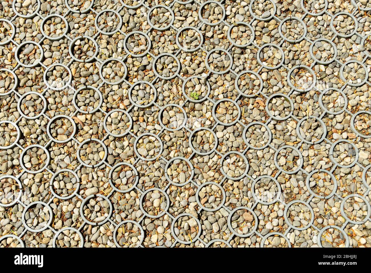 Pattern formed by a metal grid filled with compressed shale stones to ...