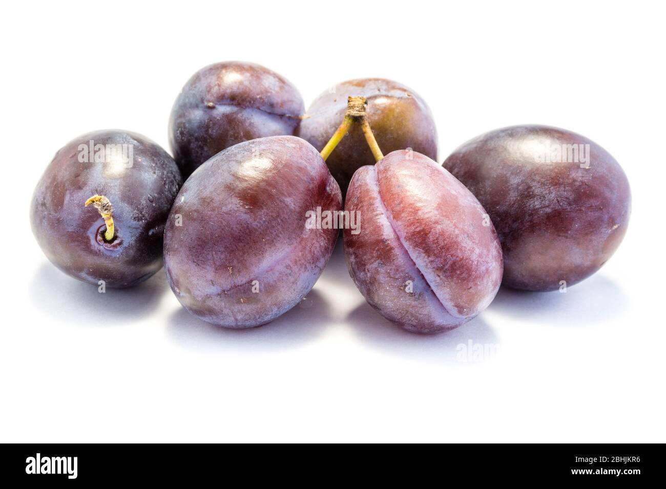 Plums isolated on white background Stock Photo - Alamy