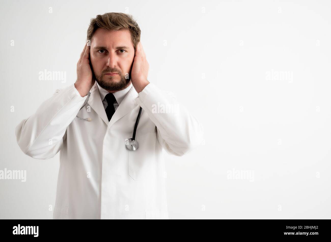 Portrait of male doctor with stethoscope in medical uniform covering ...