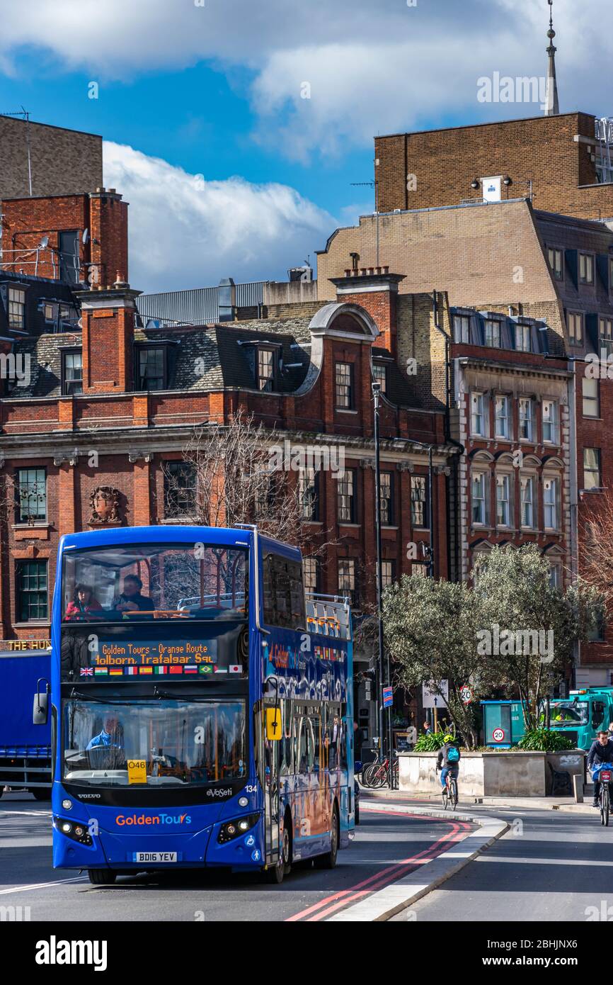 A tourist blue bus in the streets of London,UK Stock Photo - Alamy
