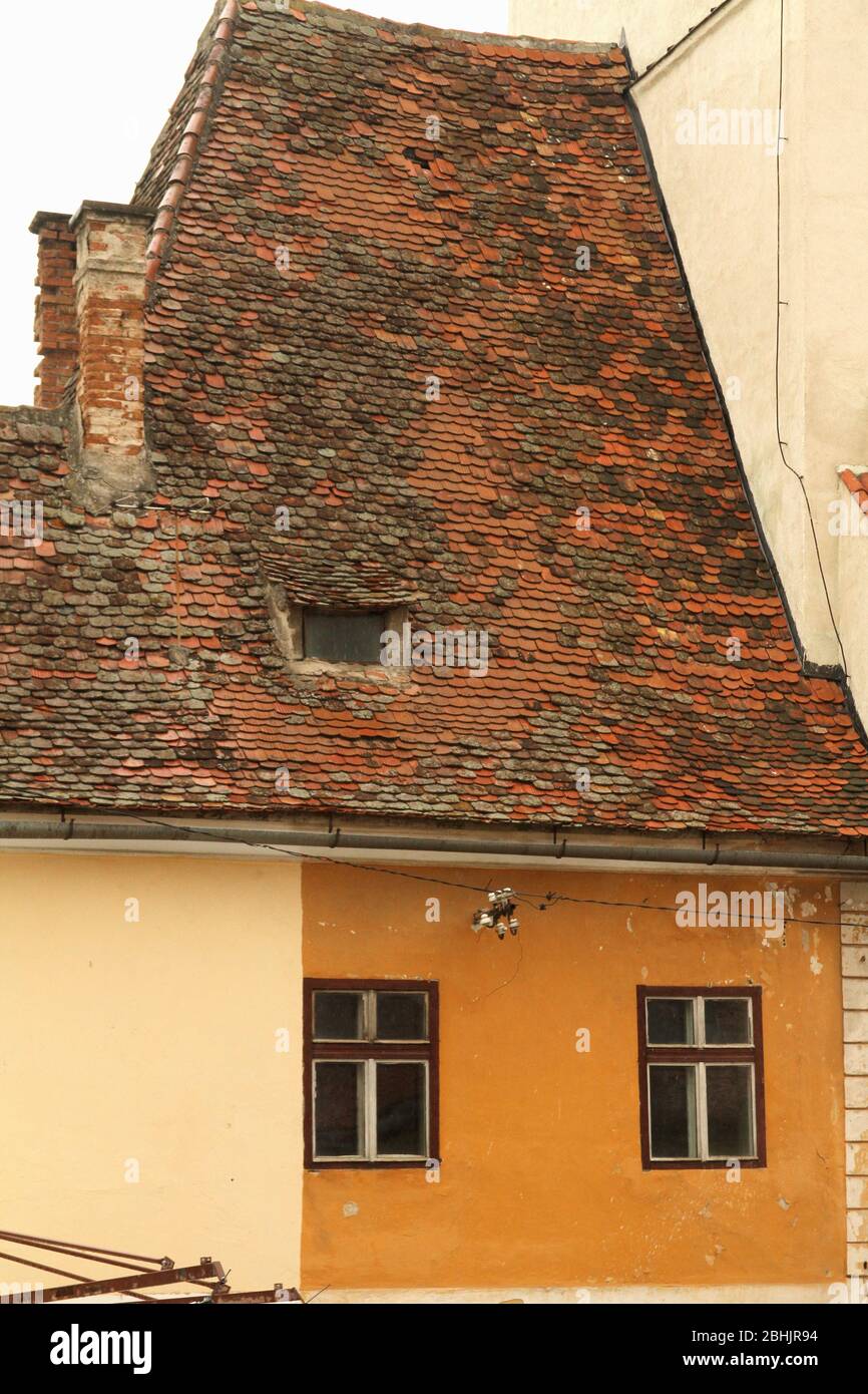 Sibiu, Romania. 15th century Saxon house with tiled roof, connected to ...