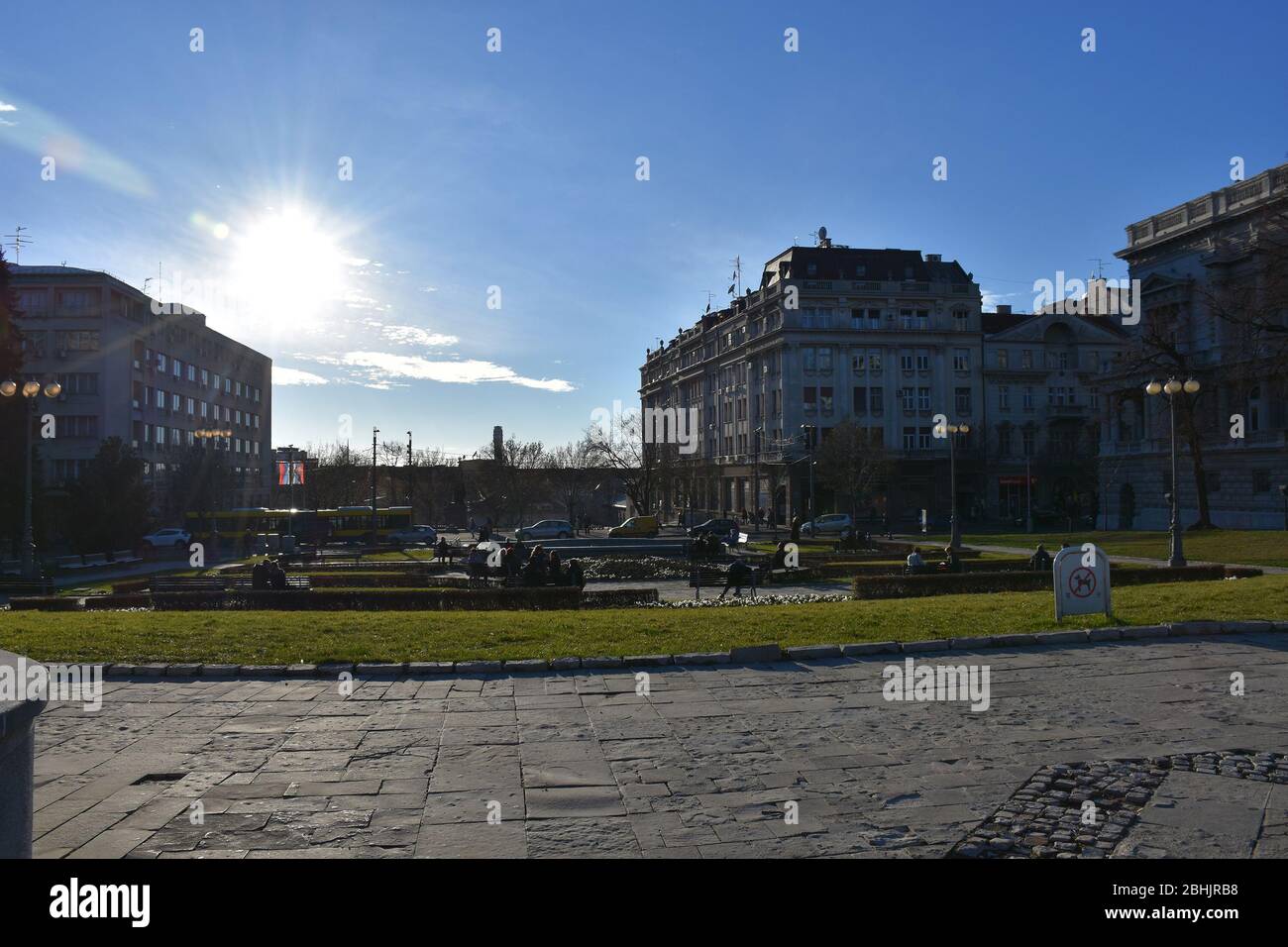 Landscaped park with benches and green grass and paved paths Stock ...