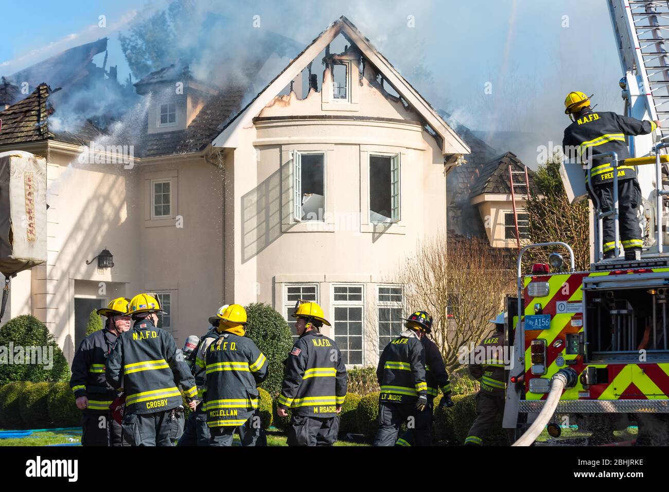 Firefighters coordinating work at a fire at 84 Castlemere Place, North ...