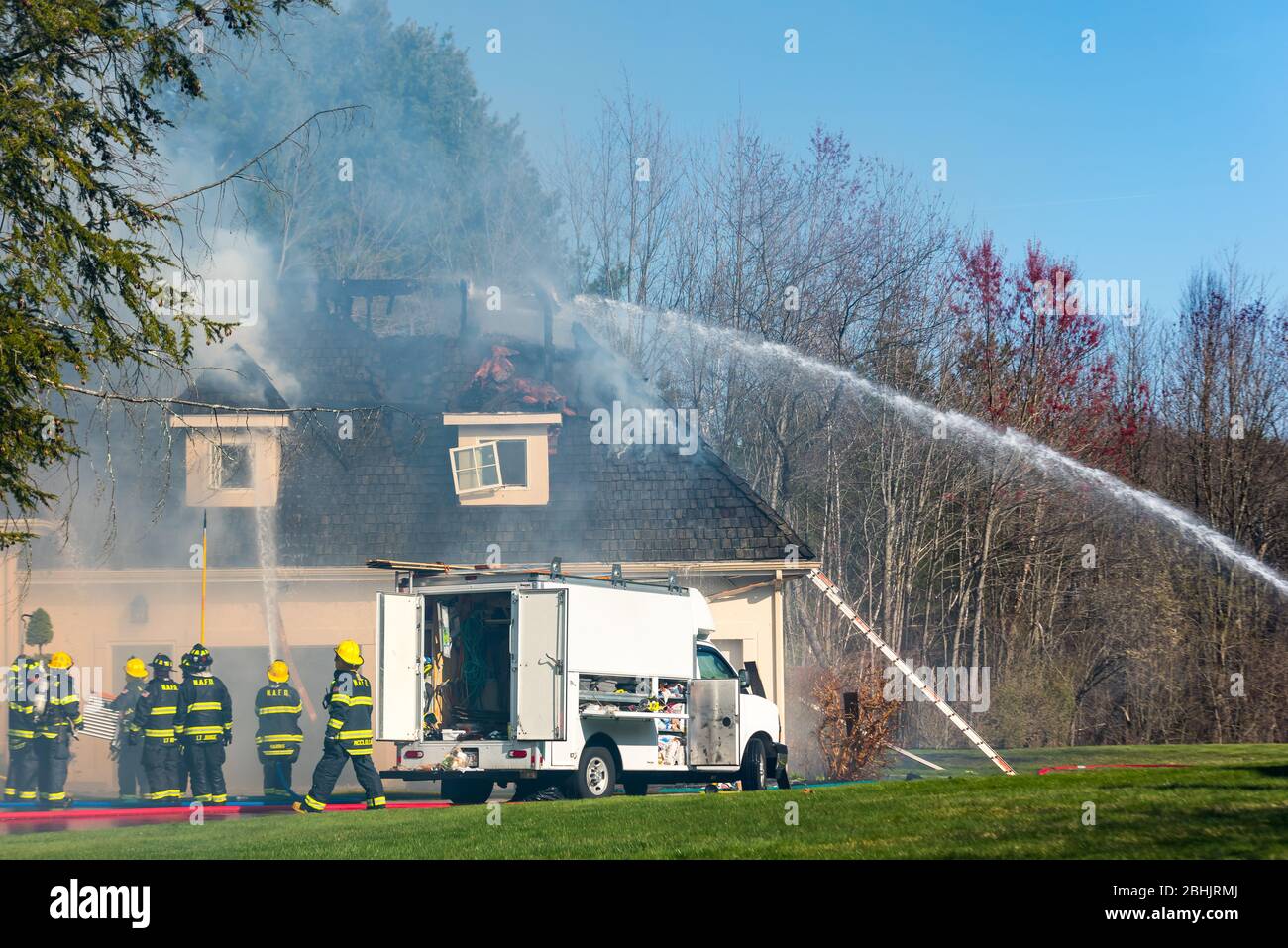 Firefighters fighting a fire from all sides at 84 Castlemere Place ...