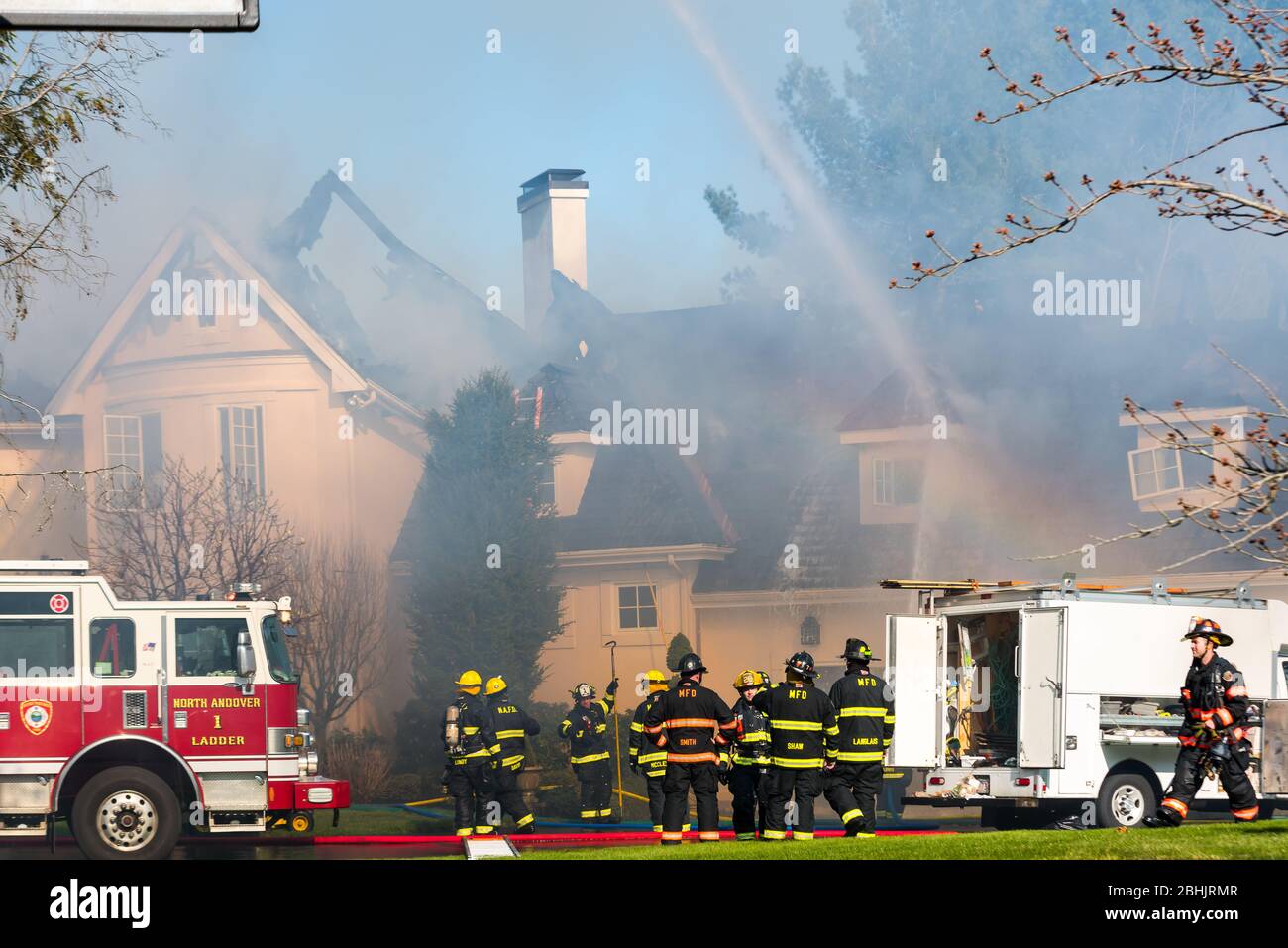 Full view of firefighters battling a fire at 84 Castlemere Place, North ...