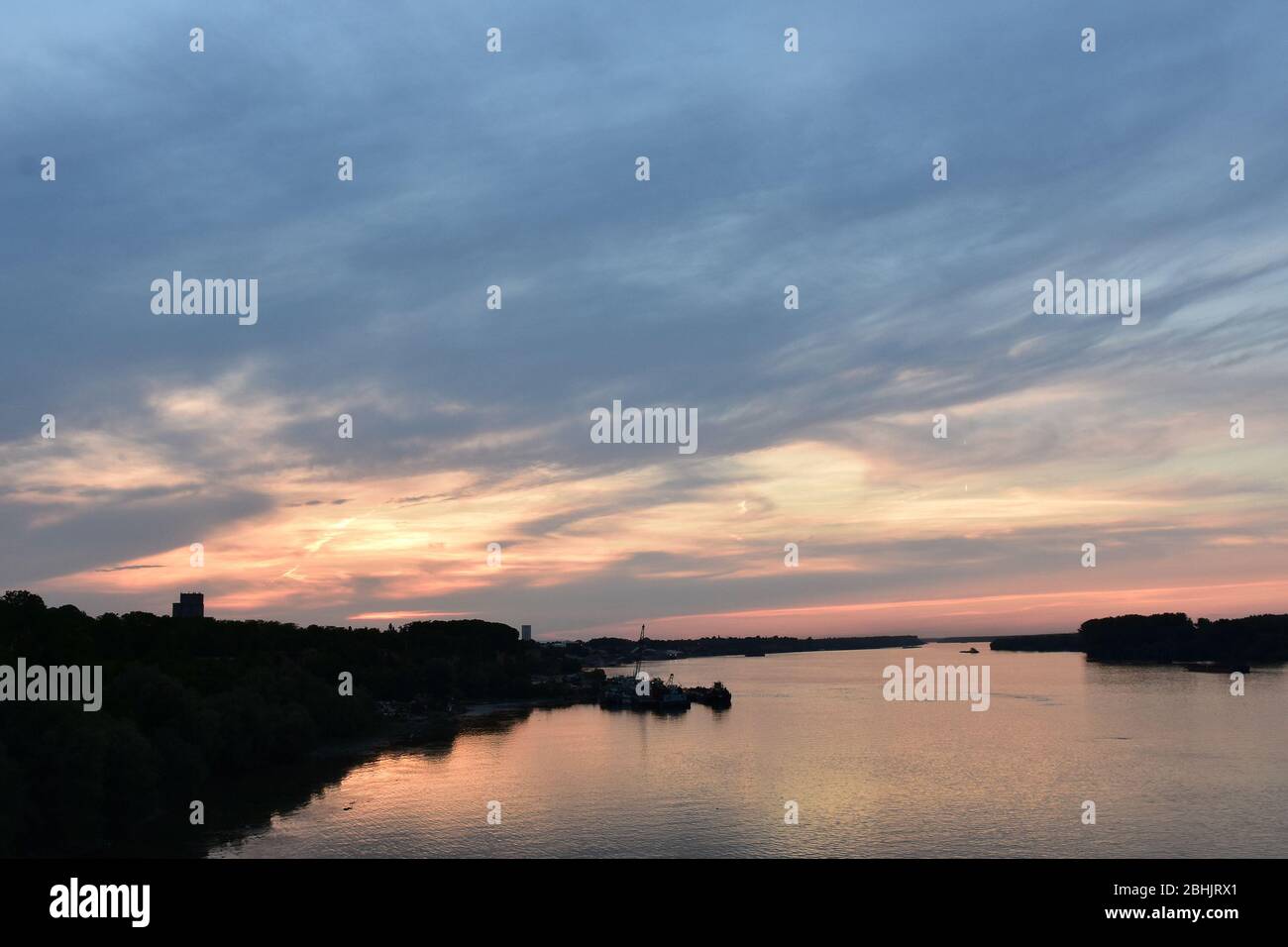 The wide river Danube landscape. Reflection of purple-blue sky in water ...