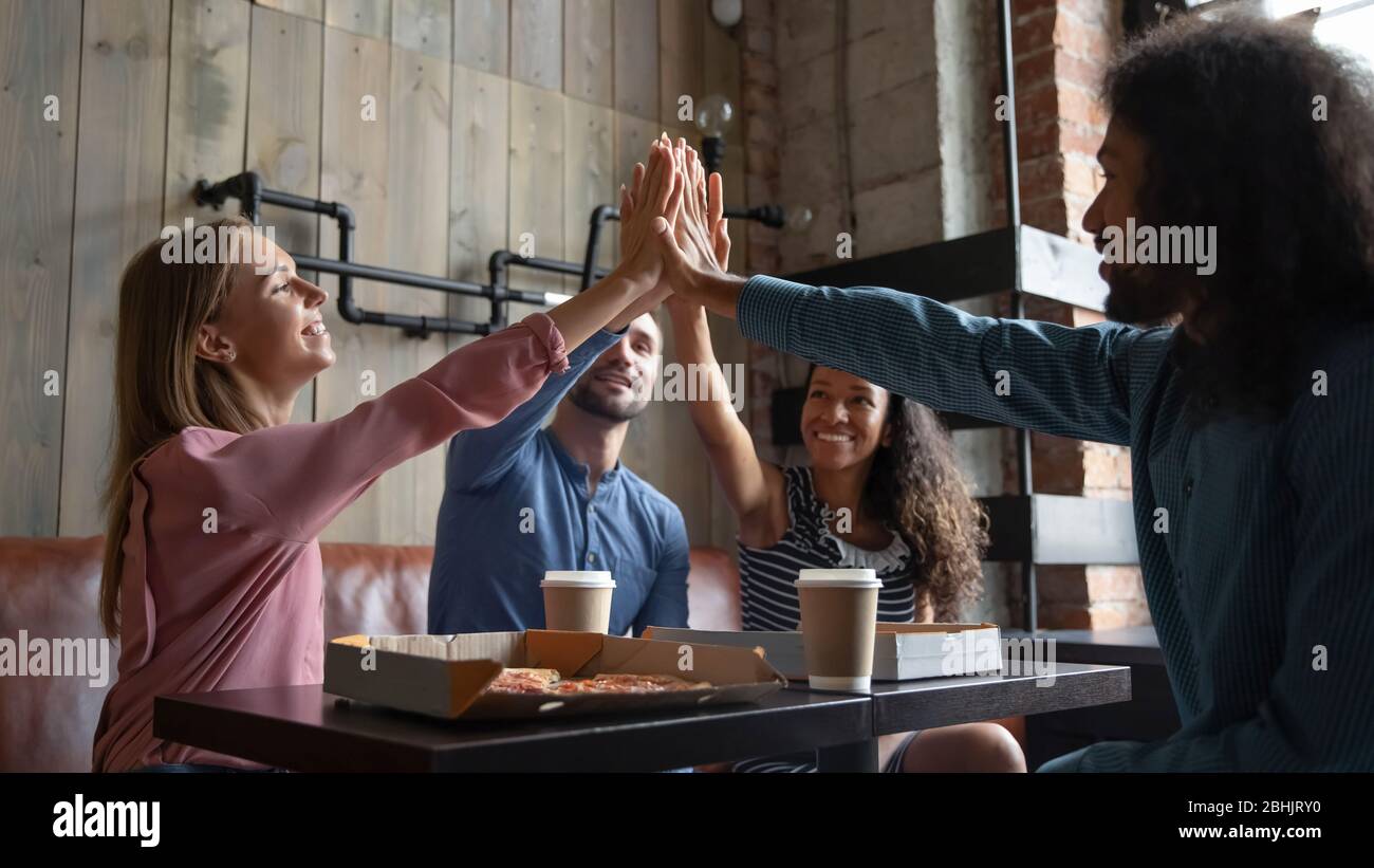 Happy diverse friends gather in cafe showing unity and friendship Stock ...