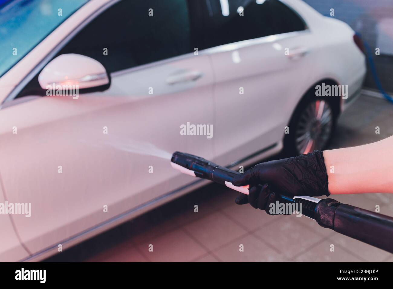 Close up cleaning car using high pressure water,High pressure jet ...
