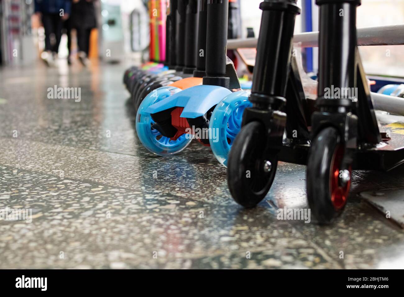 Wheels of various scooters in a row Stock Photo - Alamy