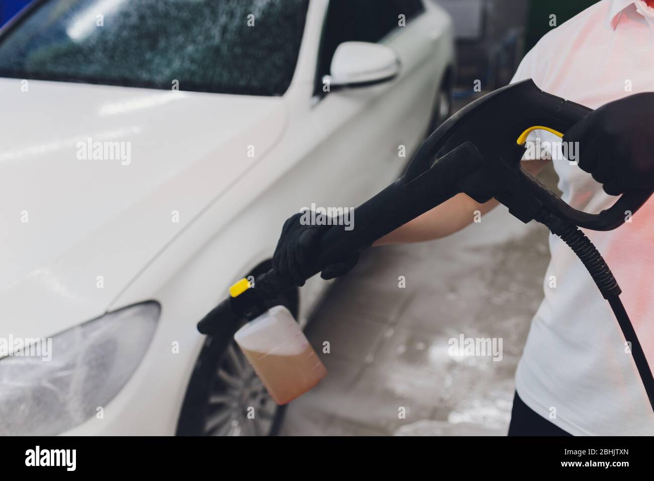 Close up cleaning car using high pressure water,High pressure jet ...