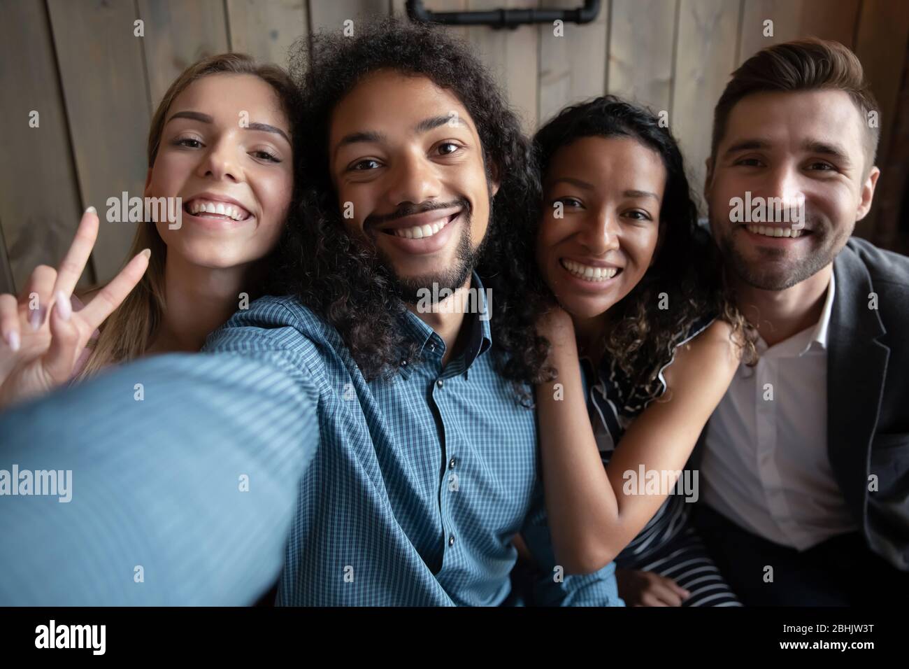 Portrait of smiling friends make selfie on gadget Stock Photo - Alamy