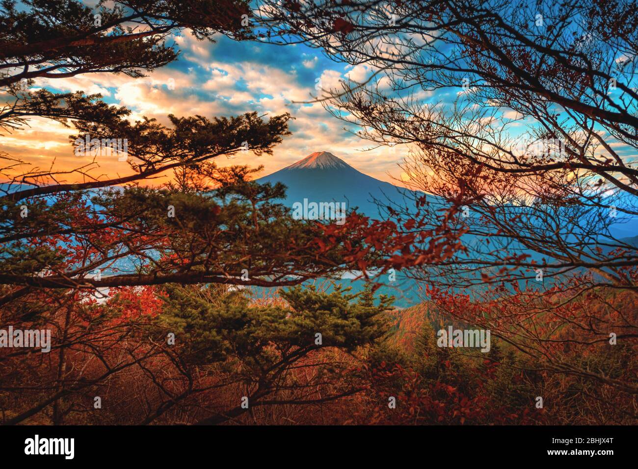 Landscape image of Mt. Fuji over Lake Kawaguchiko with autumn foliage at sunrise in ...