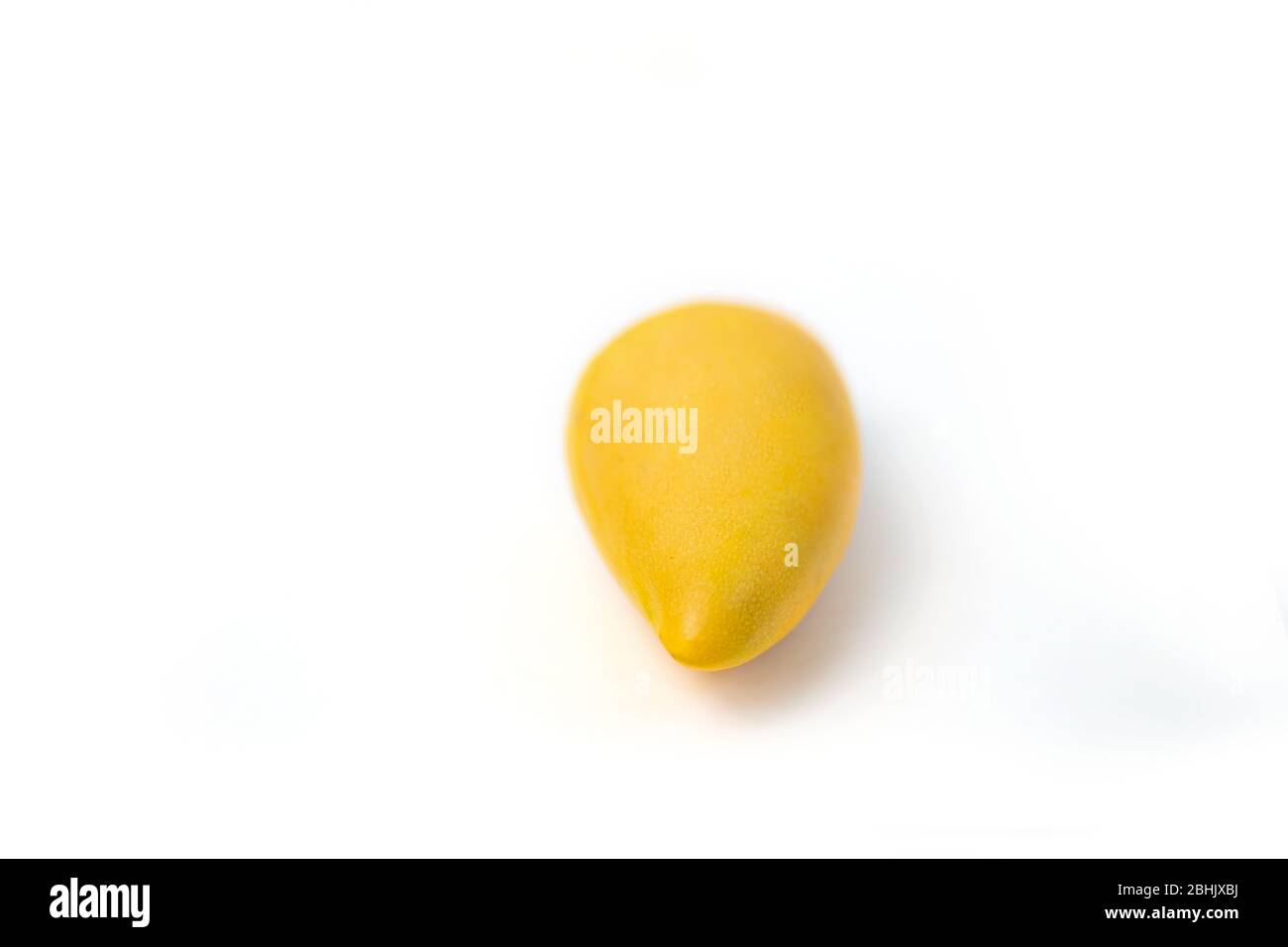 One whole mango fruit. Delicious ripe juicy fresh yellow mango isolated ...