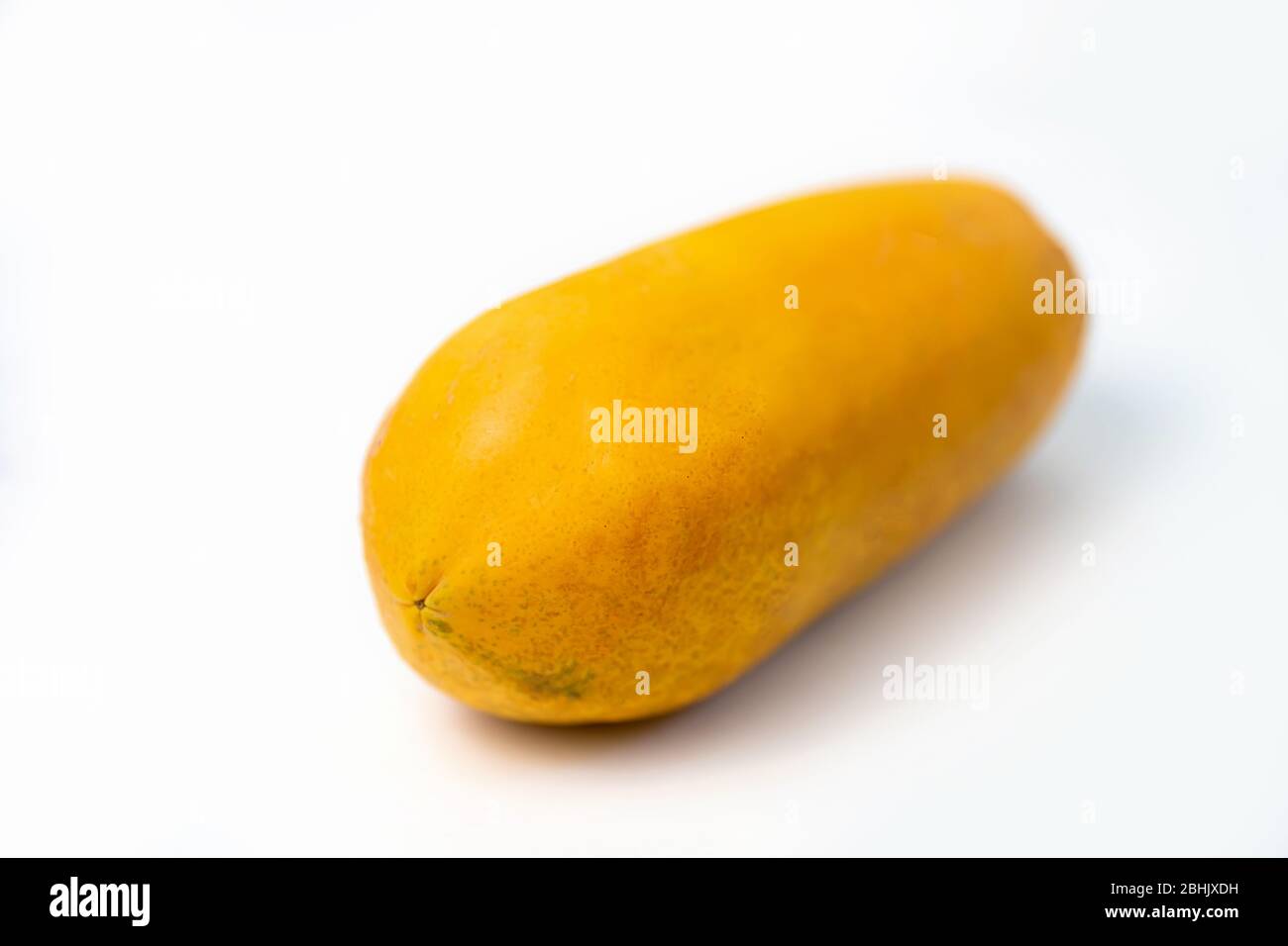 Delicious ripe fresh yellow papaya isolated on white background. One ...