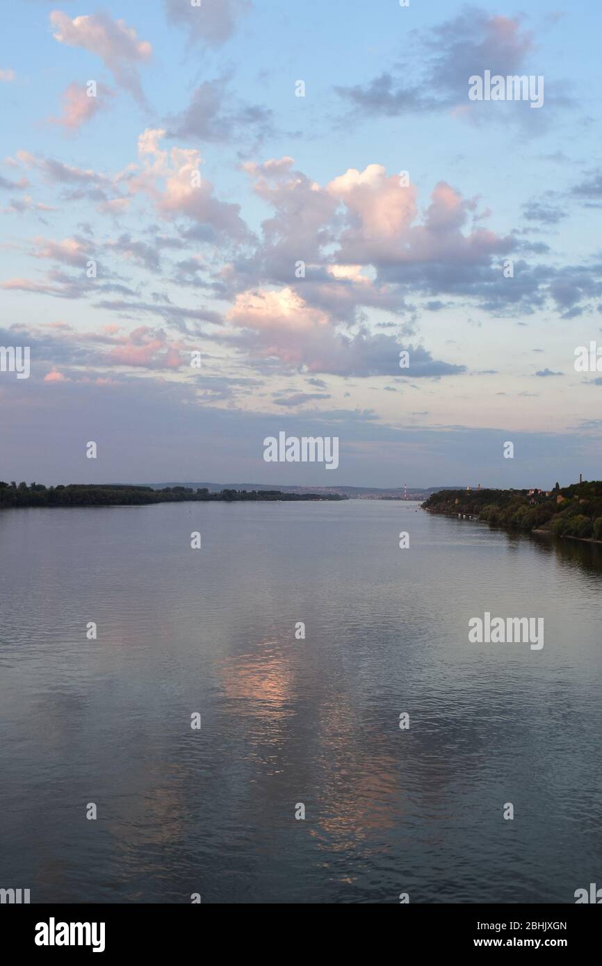 Colorful sky above the broad water of the Danube Stock Photo - Alamy