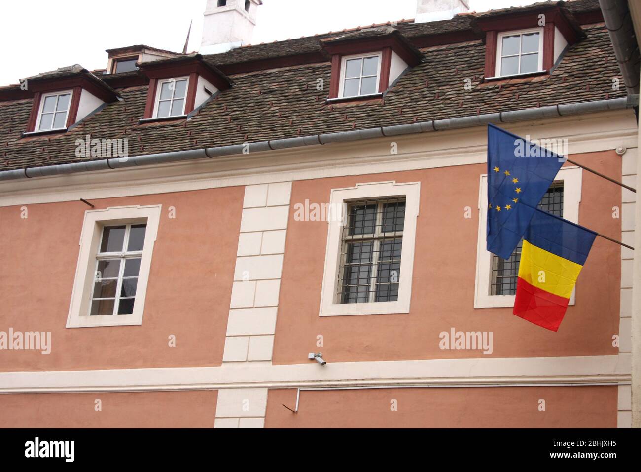 The European flag and the Romanian flag seen in the Old Town of Sibiu ...