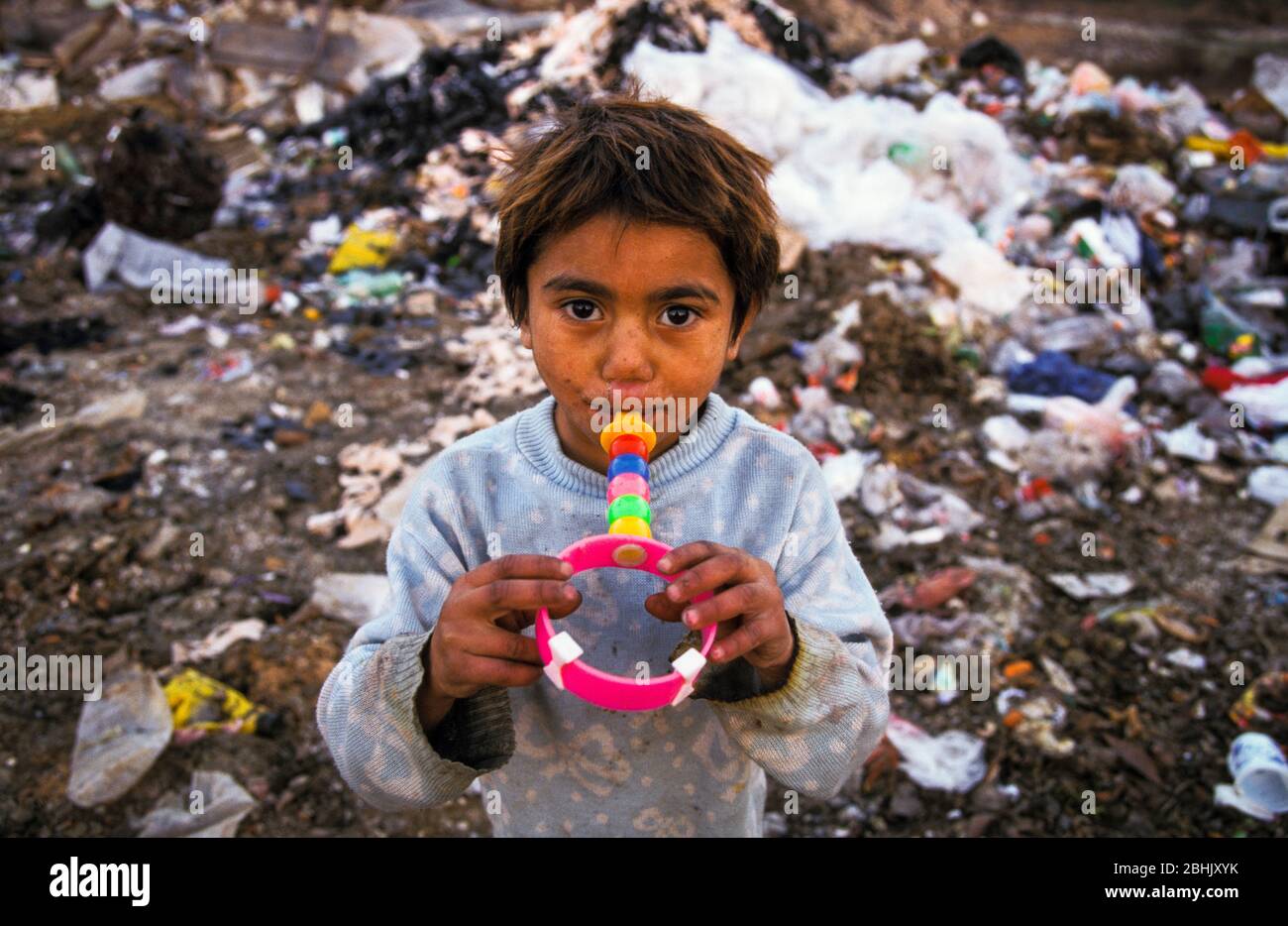Roma child with toy recovered from the mounds of waste at the ...