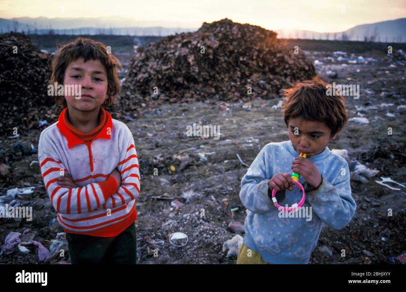 Roma children with toy recovered from the mounds of waste at the ...