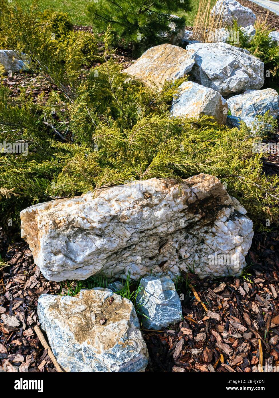 The use of large stones in garden landscaping Stock Photo - Alamy