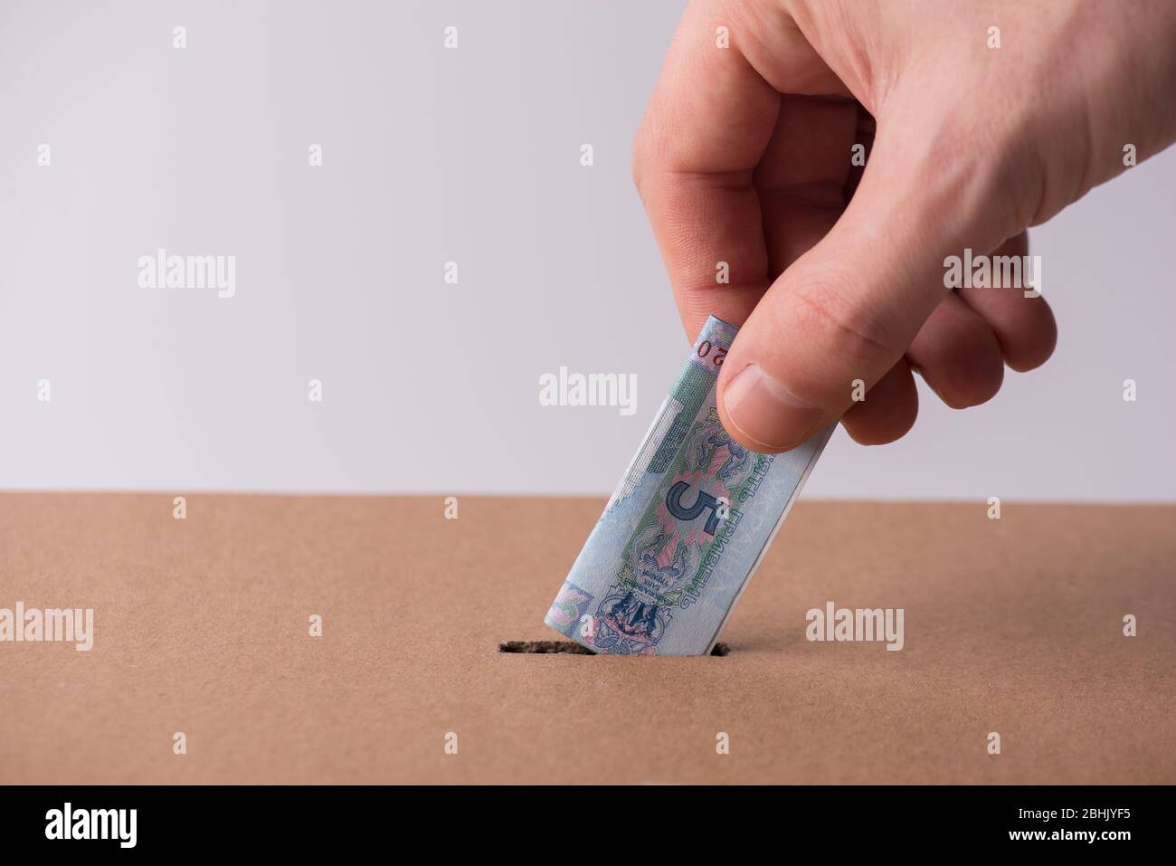 Money box and hand and jar hi-res stock photography and images - Alamy