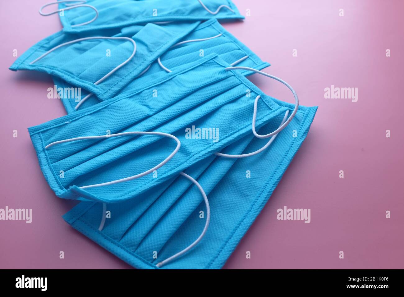 surgical masks on pink background, close up Stock Photo - Alamy