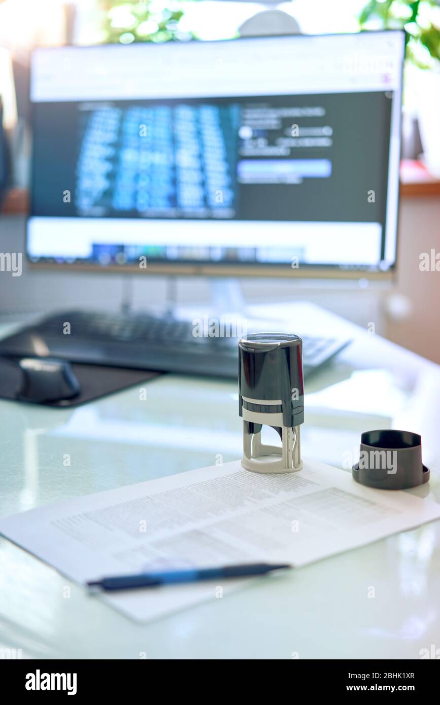 desktop in the office with documents and a seal Stock Photo - Alamy