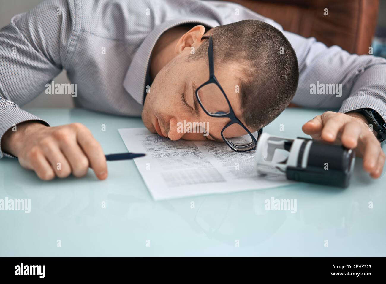 the man puts a seal on the document Stock Photo - Alamy